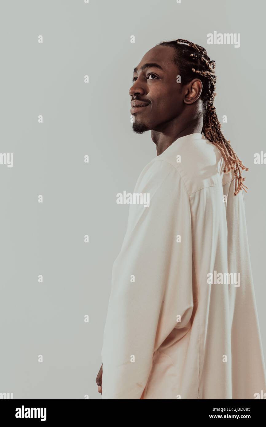 Portrait of handsome african black man in traditional islamin sudan fashion clothes. Selective ...