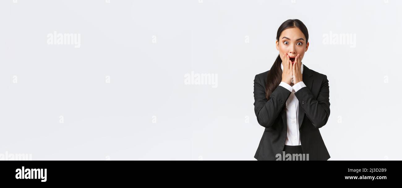 Shocked concerned asian businesswoman facing troublesome situation ...