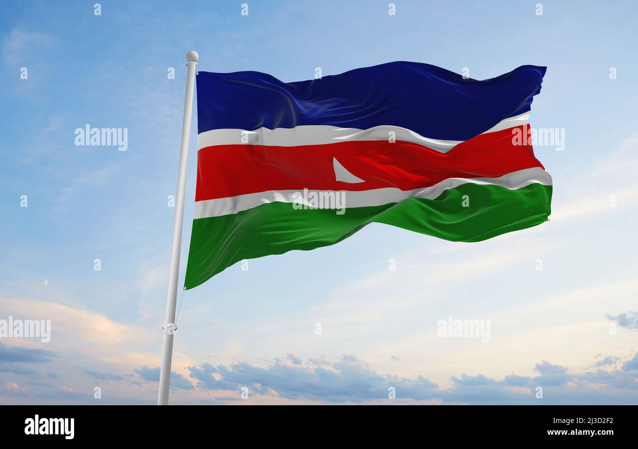 flag of Juiz de Fora , Brazil at cloudy sky background on sunset ...