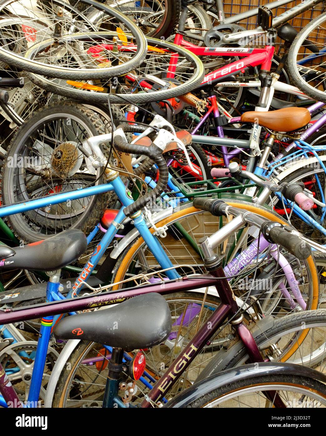 Piles of bikes waiting to be recycled Stock Photo - Alamy