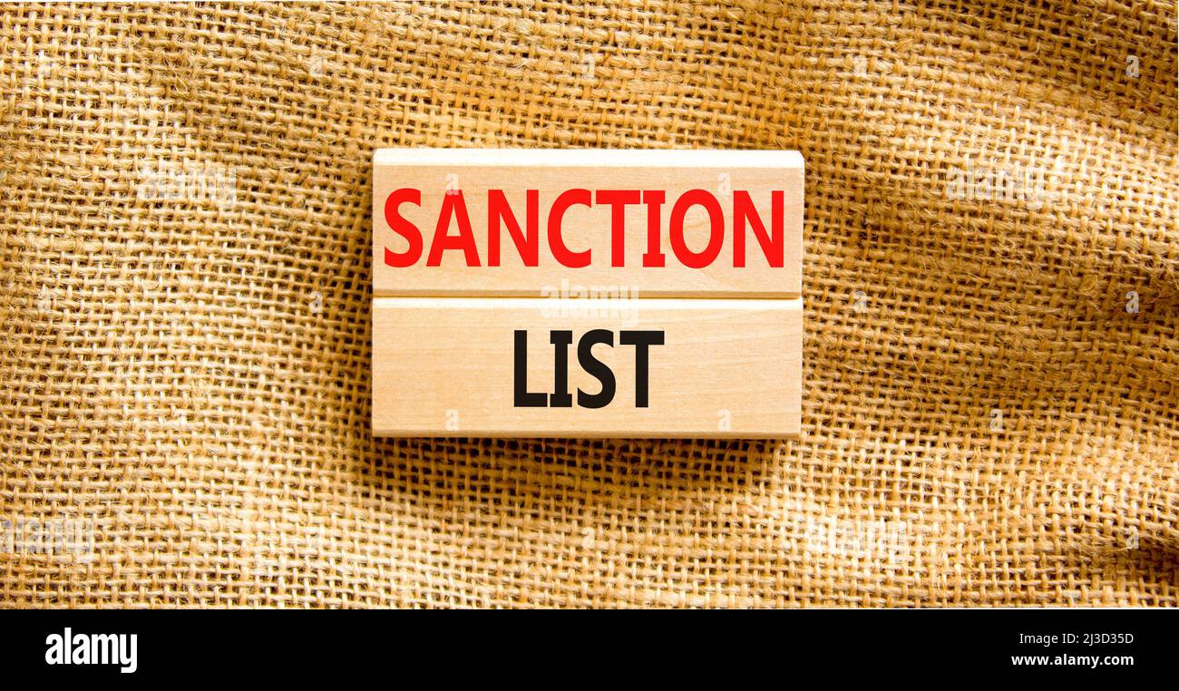 Sanction list symbol. Wooden blocks with concept words Sanction list on ...
