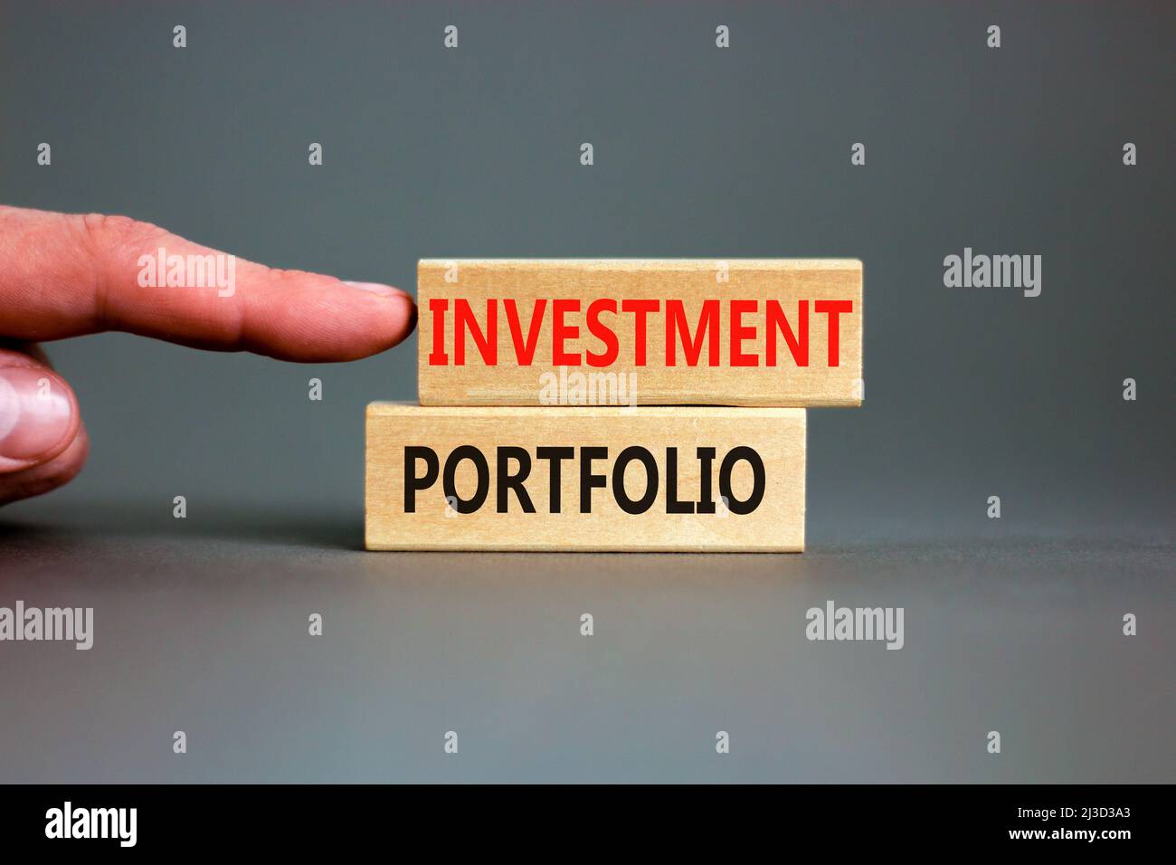 Investment portfolio symbol. Wooden blocks with concept words ...