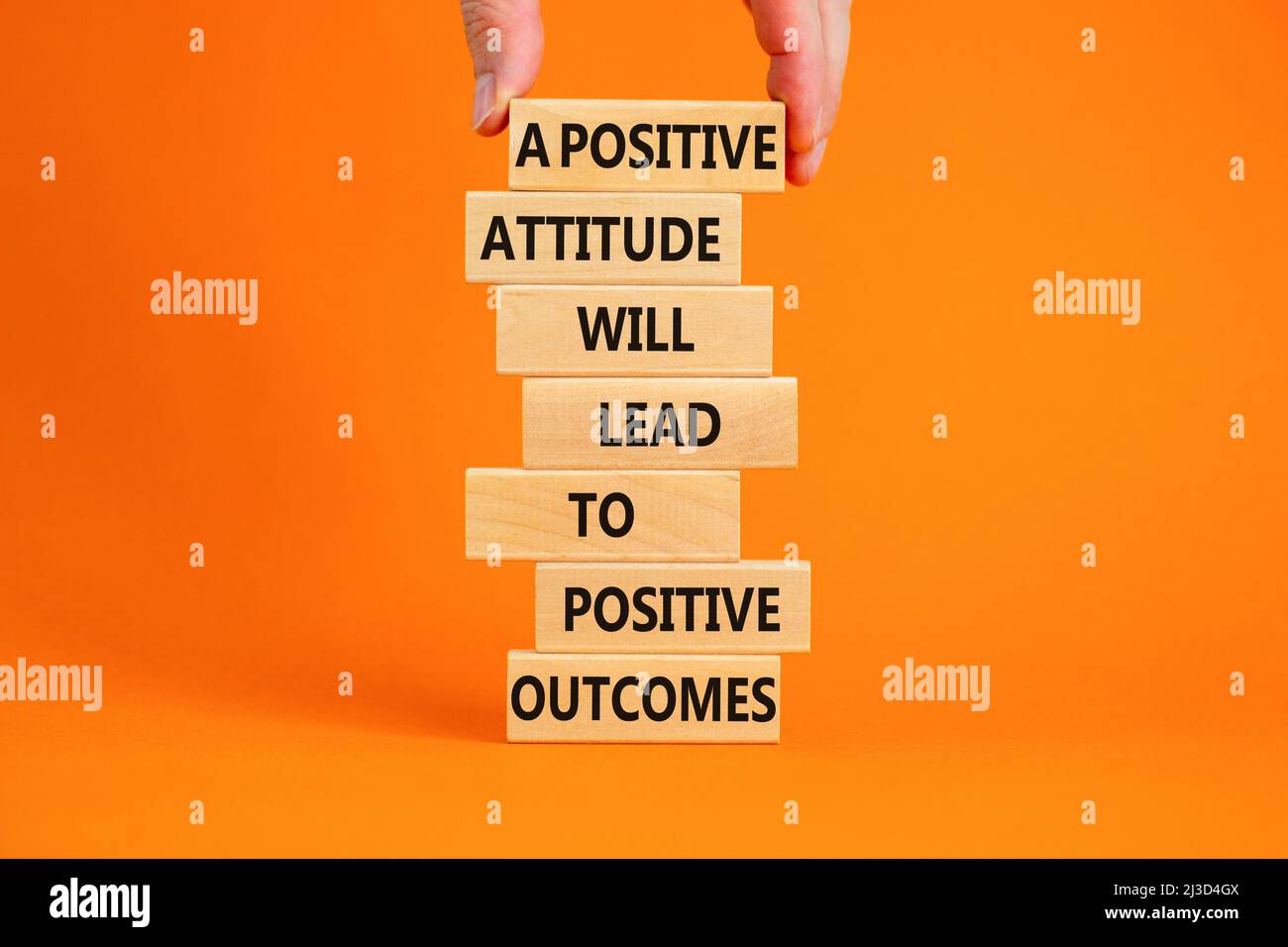 Think positive symbol. Wood blocks with words A positive attitude will ...