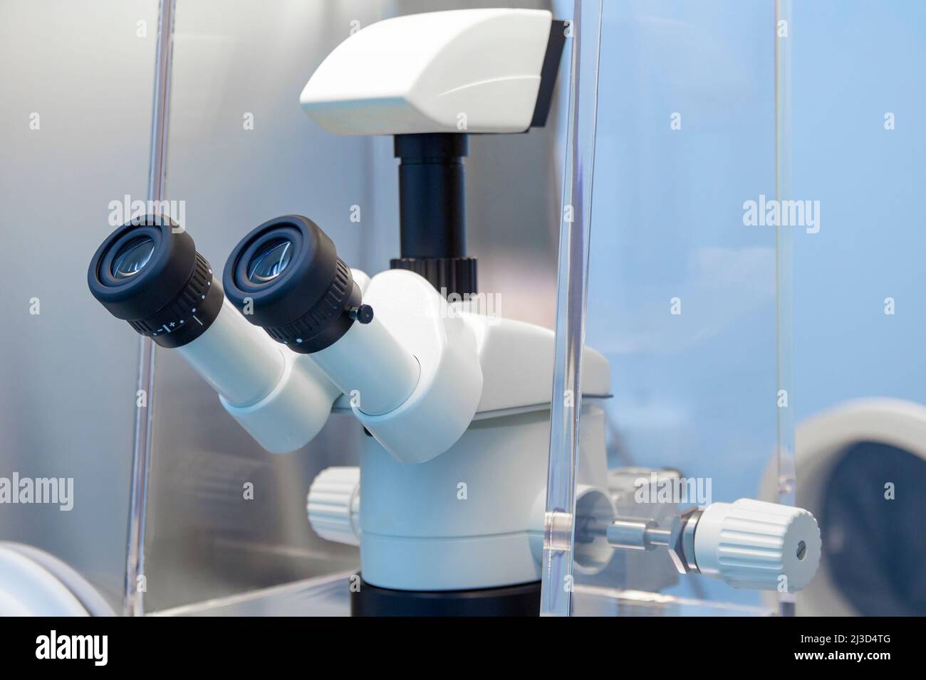 The eyepieces of a light or fluorescent microscope in a research ...