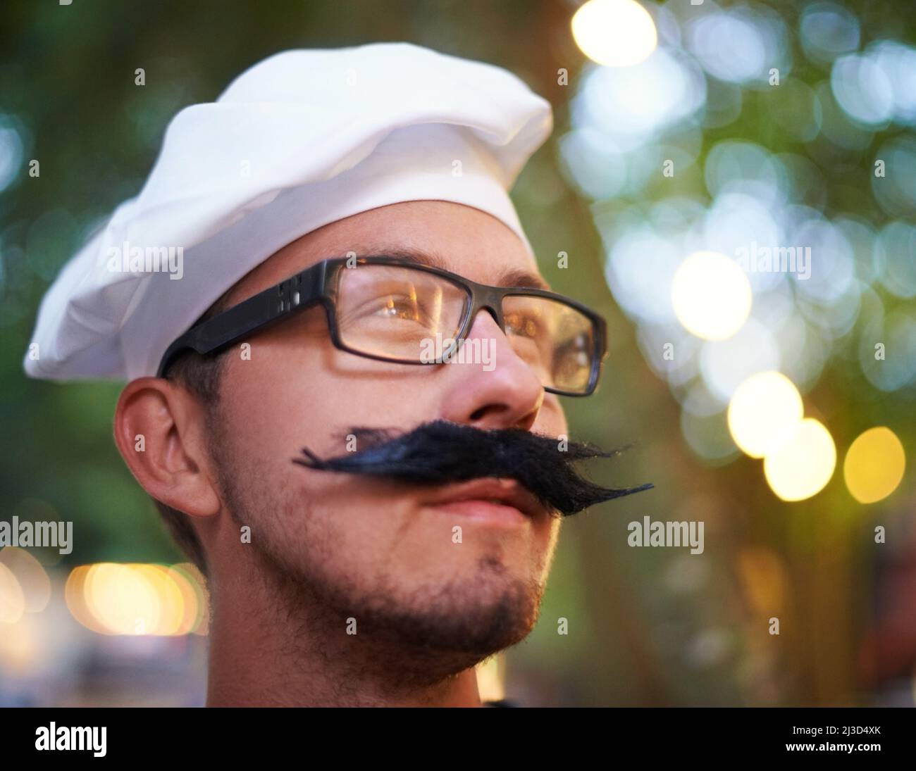 French attire. A young man dressed up in a beret and a fake mustache ...