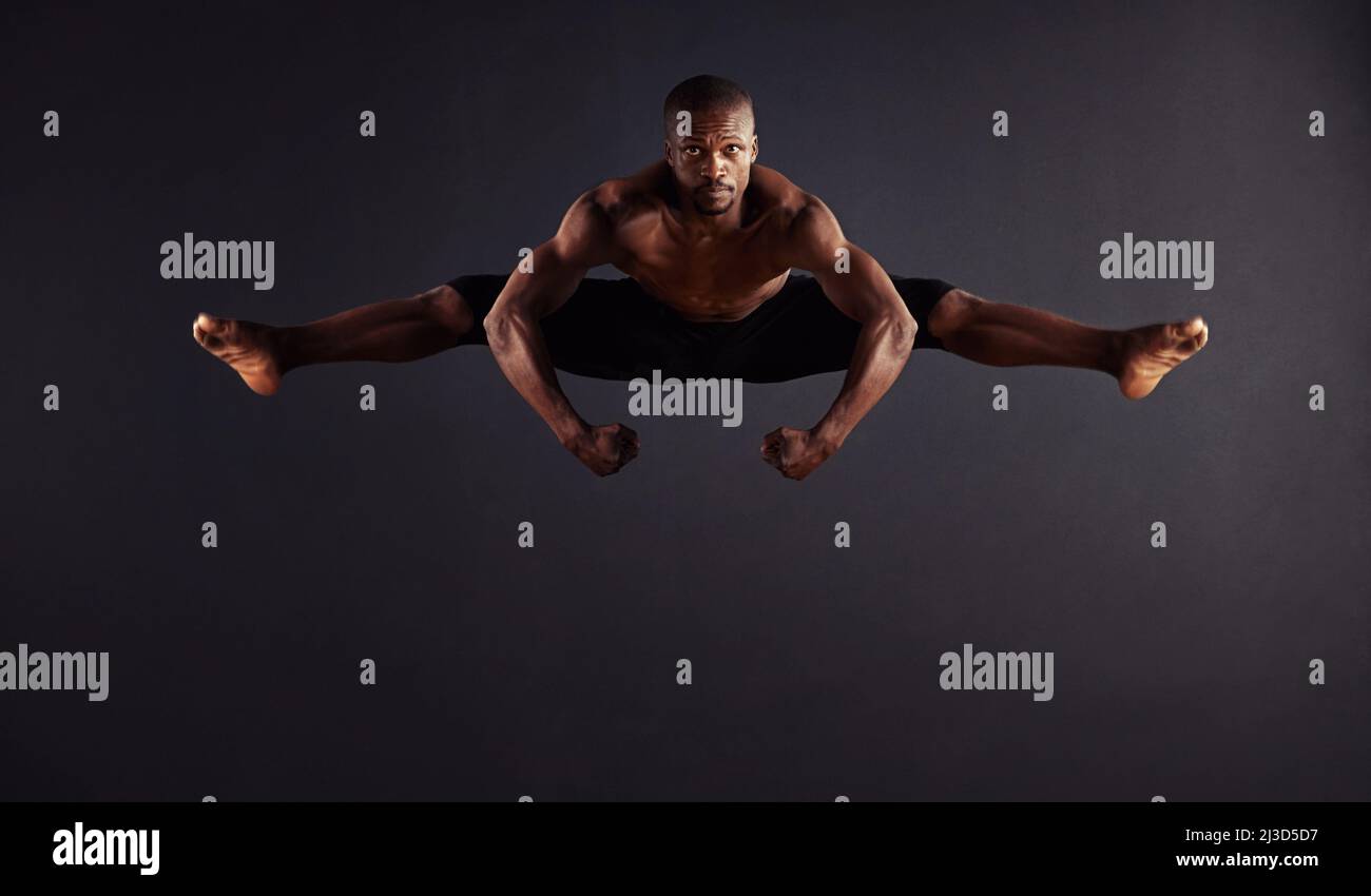 Perfection attained. Male dancer performing the splits in mid-air Stock ...