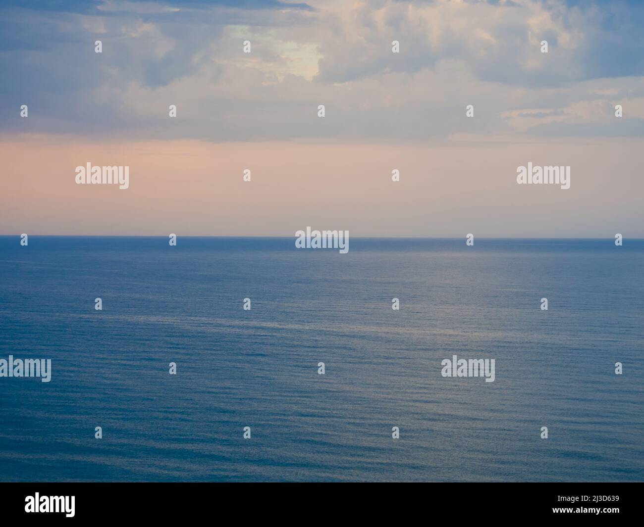 landscape with cloudy sky and ripples at sea Stock Photo - Alamy