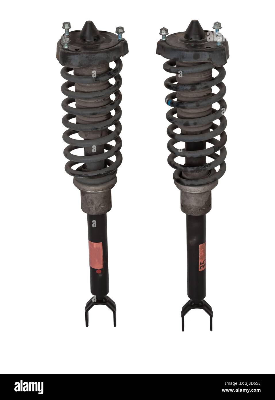 Shock absorber struts with black springs after being used on a car ...