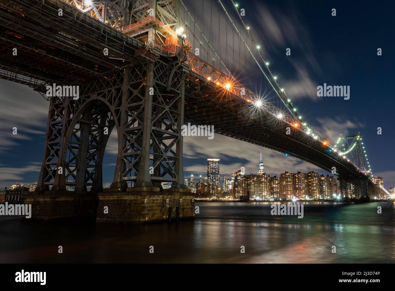 Night time view of Williamsburg Bridge and Manhattan skyline from Domino Park, Williamsburg ...