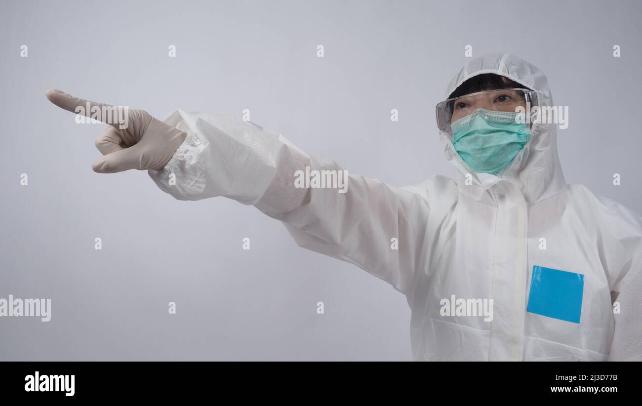 Doctor in PPE suit wearing white medical rubber gloves and clear ...