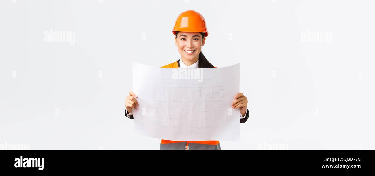 Excited smiling asian female engineer at construction area study ...