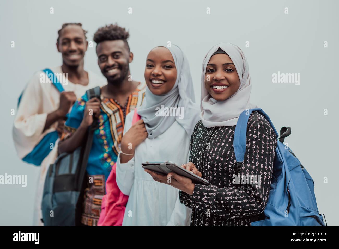 Photo of a group of happy african students talking and meeting together ...