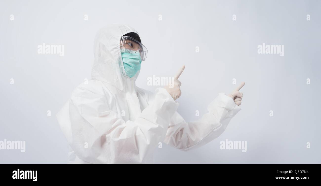 Doctor in PPE suit wearing white medical rubber gloves and clear ...