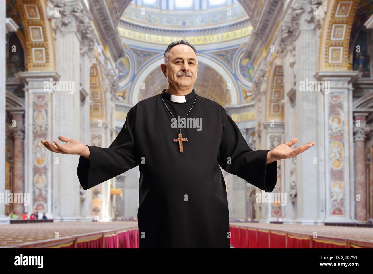 Priest spreading arms inside a cathedral Stock Photo - Alamy