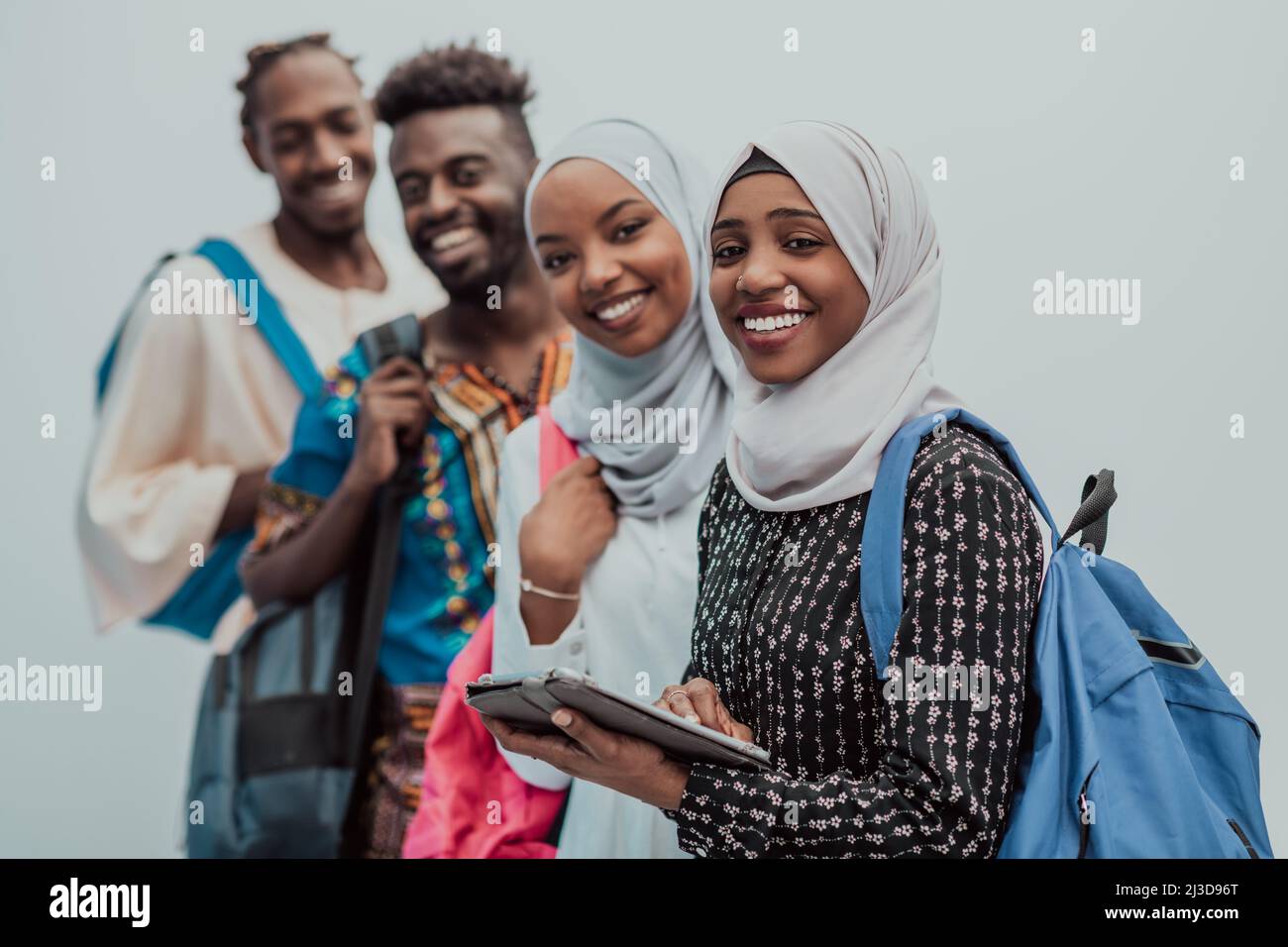 Photo of a group of happy african students talking and meeting together ...