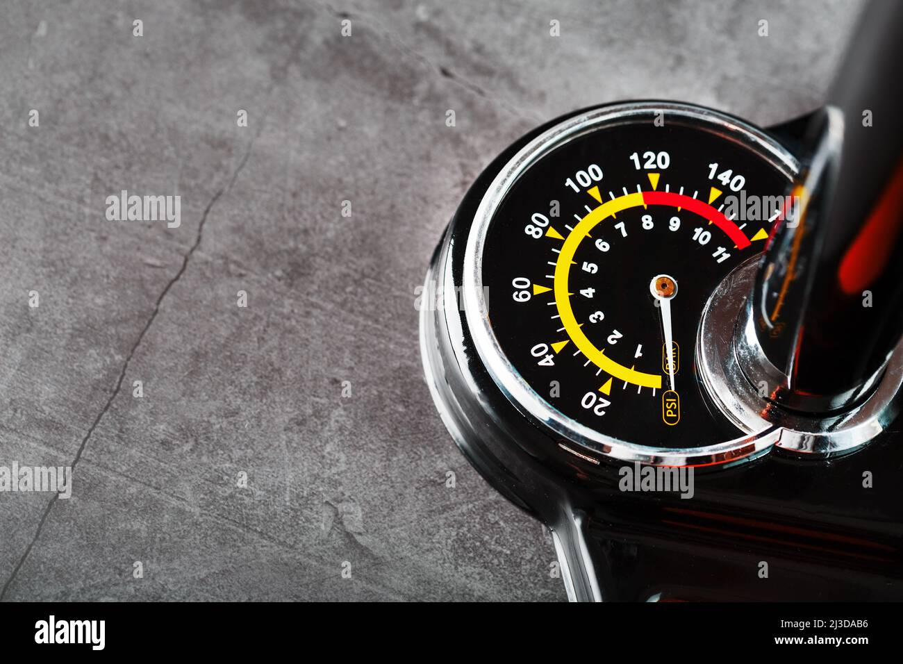 Hand air pump manometer for pressure control on a dark background close ...