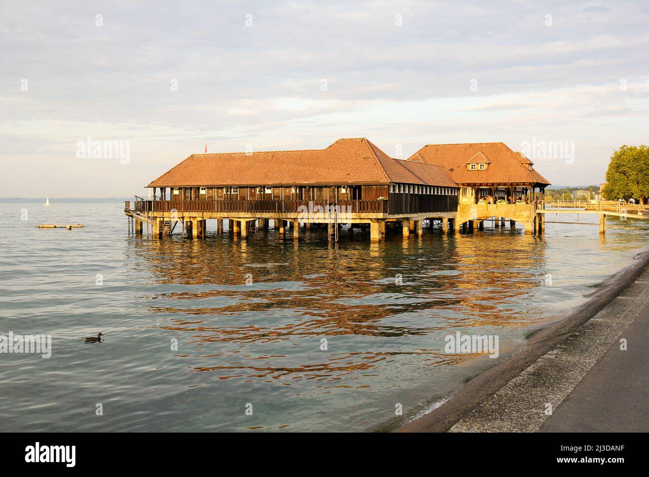 Public bathing wooden hut at sunset hours on the Lake of Constance ...