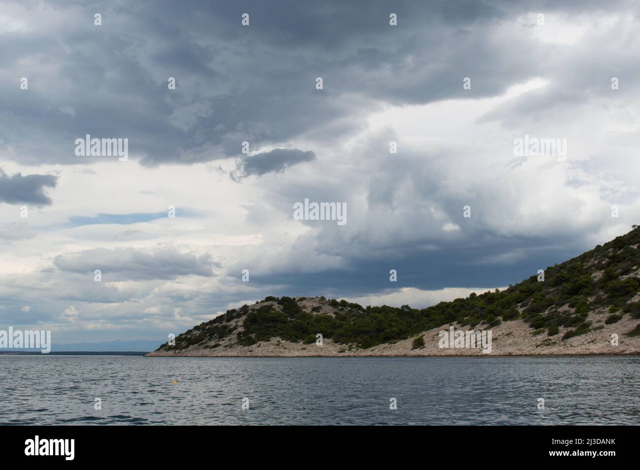 Cloudy sky with various shades of blue color over the Adriatic sea, in ...