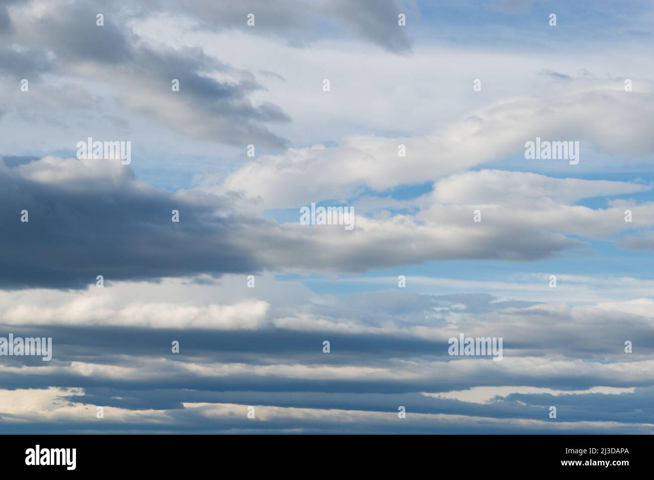 Cloudy sky with various shades of blue color Stock Photo - Alamy