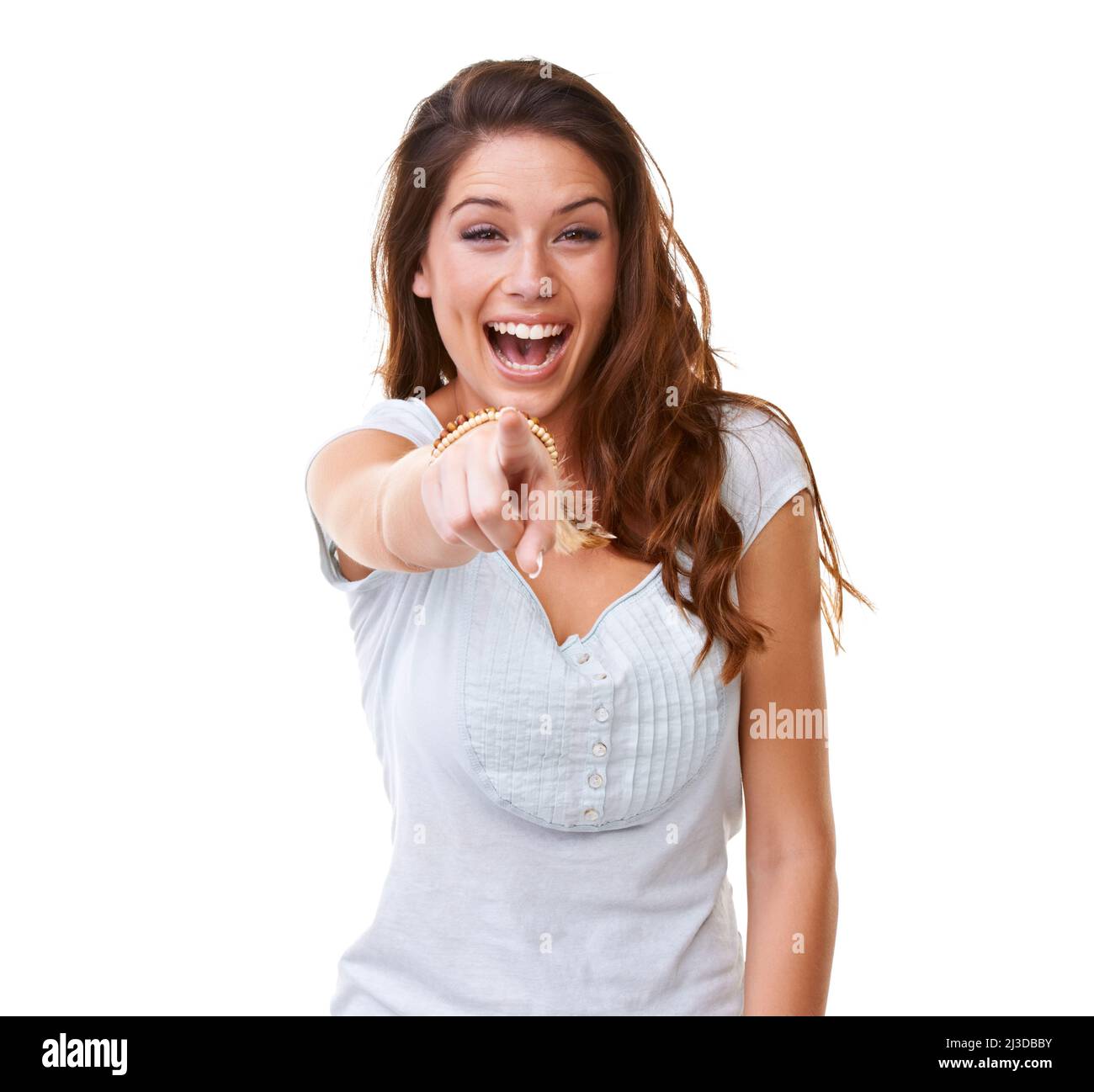 Genuine laughter. A gorgeous young woman laughing and pointing at the ...
