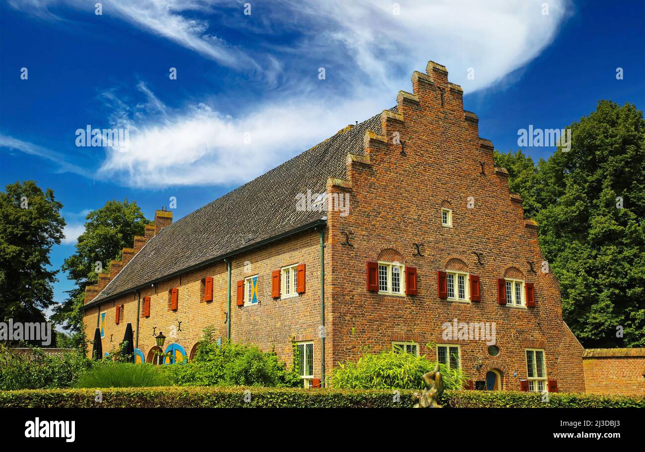 View on typical dutch medieval gabled stone house with garden and green ...