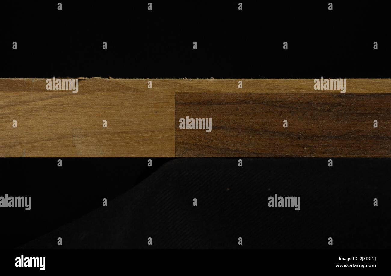 side cut piece of walnut solid block worktop isolated on a black ...