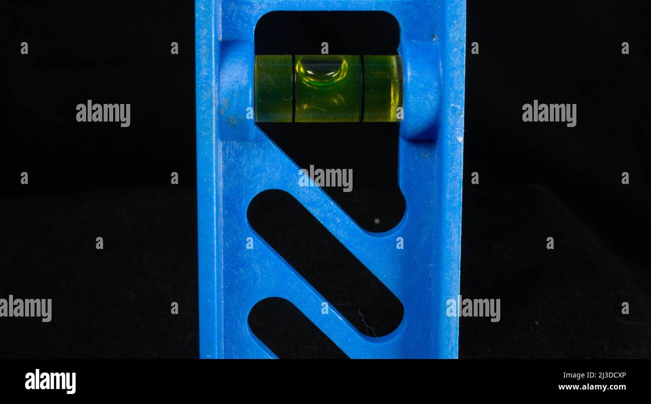 the end or vertical green bubble and blue spirit level isolated on a ...