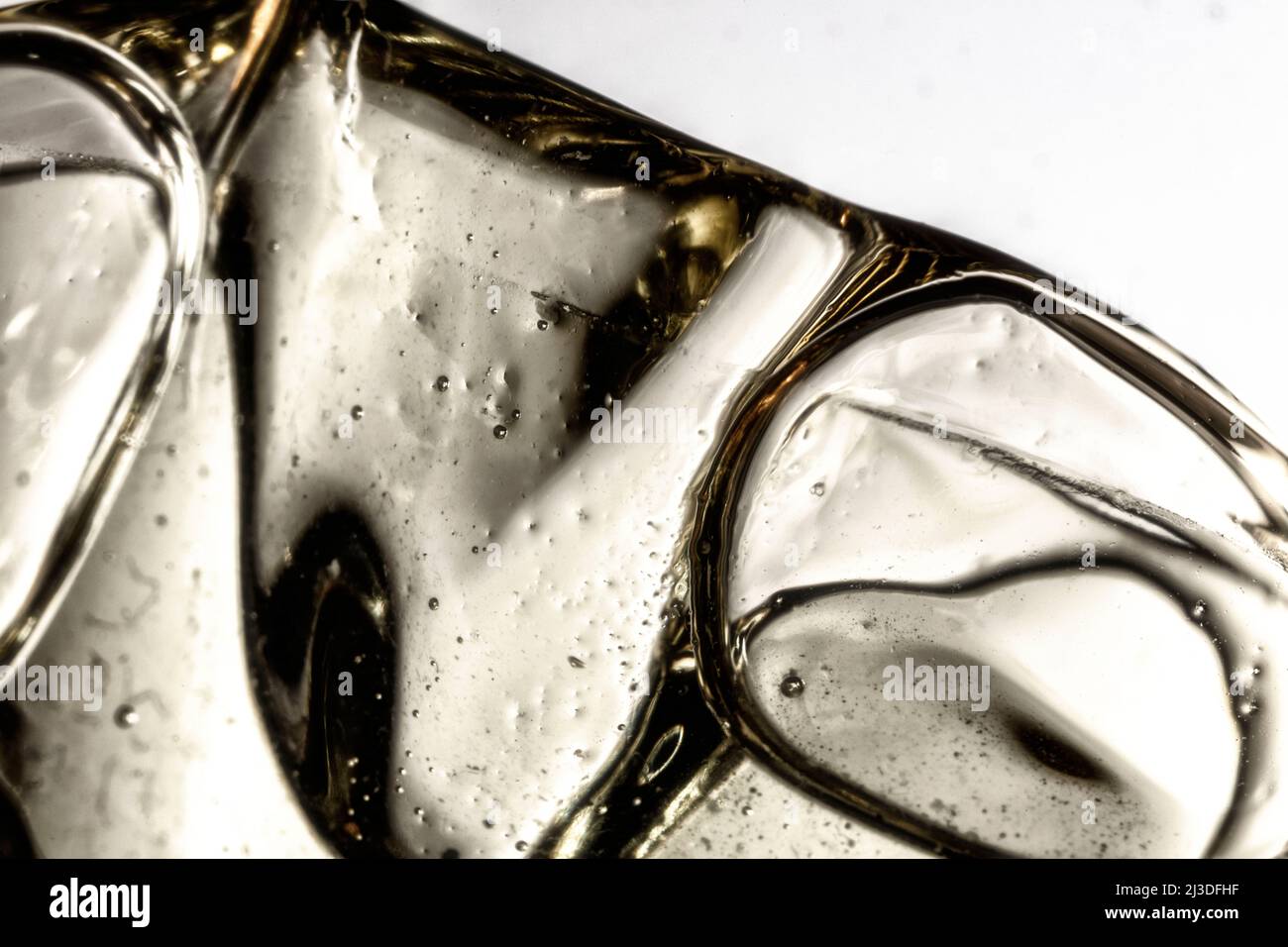 Macro still-life showing abstract patterns in Omega-3 oil capsule ...