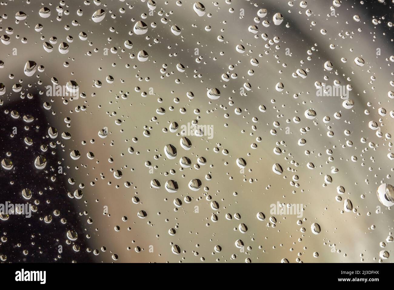 Abstract irregular water drops macro showing reflected colours Stock ...