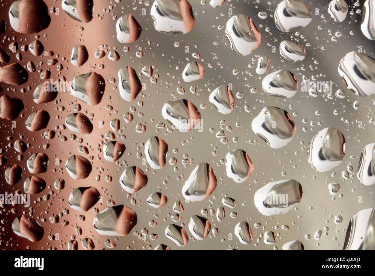Abstract irregular water drops macro showing reflected colours Stock ...
