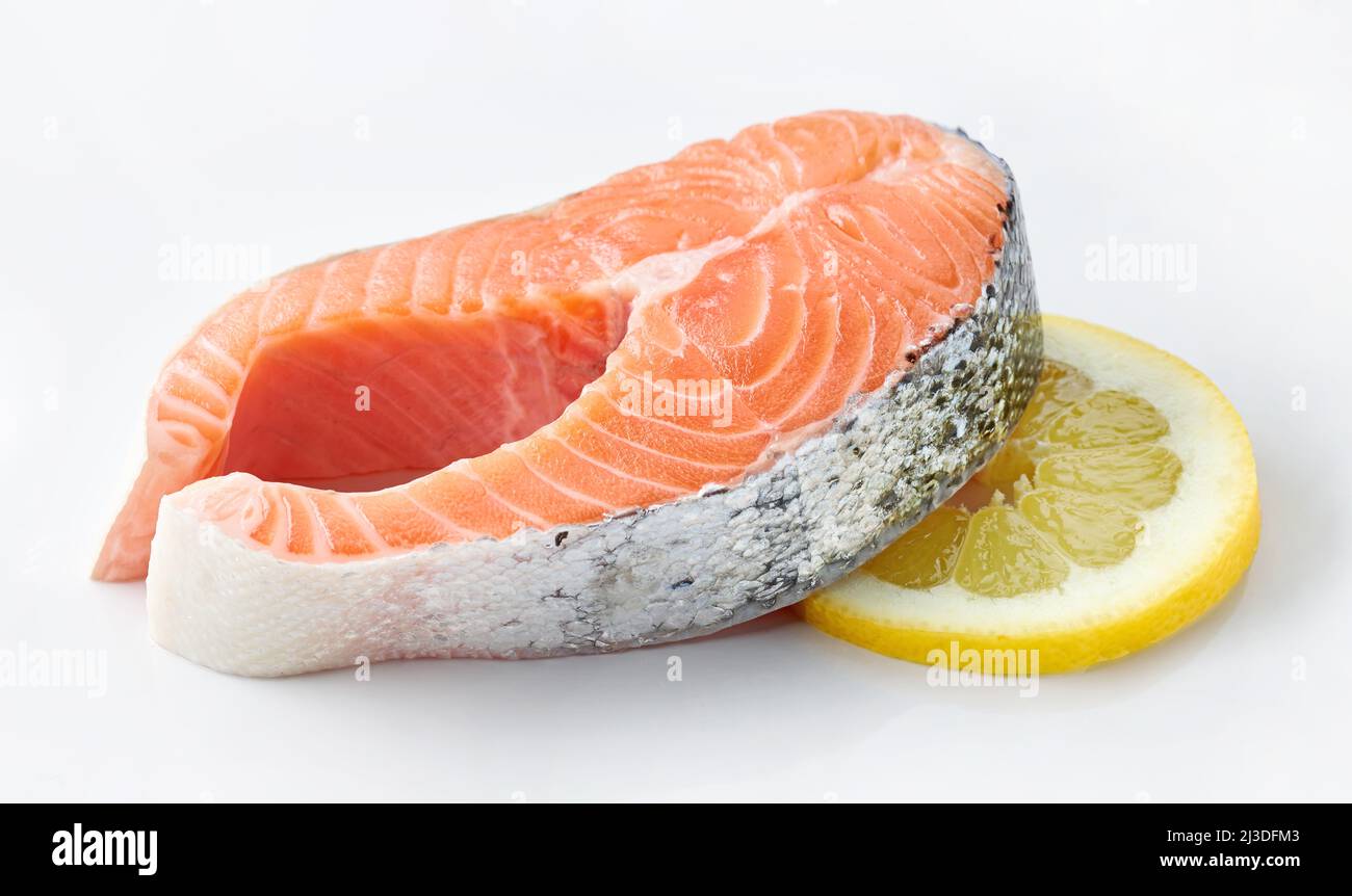 fresh raw salmon steak on white background Stock Photo - Alamy