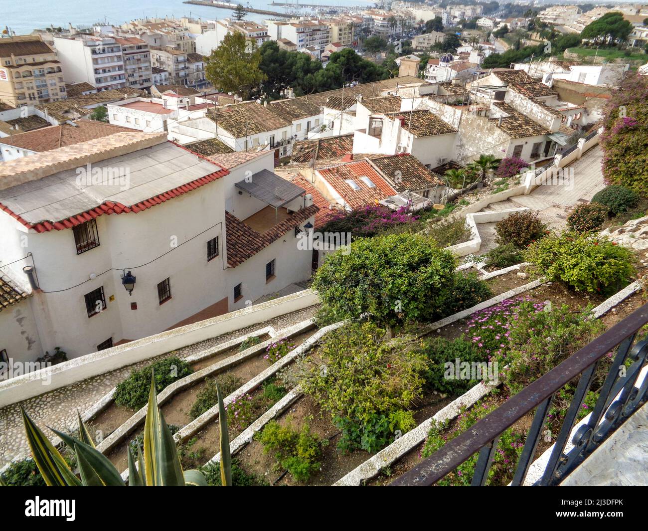 Architectural detail of mainly white dwellings and colourful lamps in ...