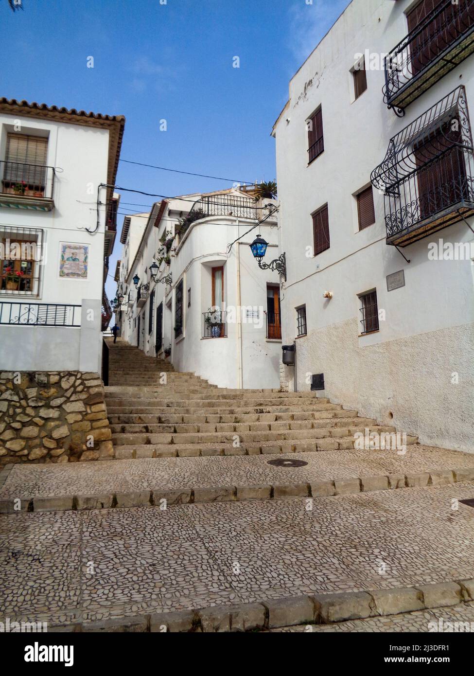 Architectural detail of mainly white dwellings and colourful lamps in ...