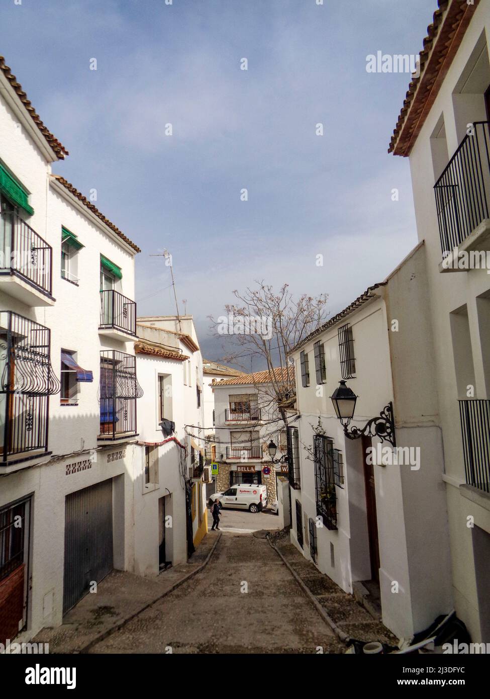 Architectural detail of mainly white dwellings and colourful lamps in ...