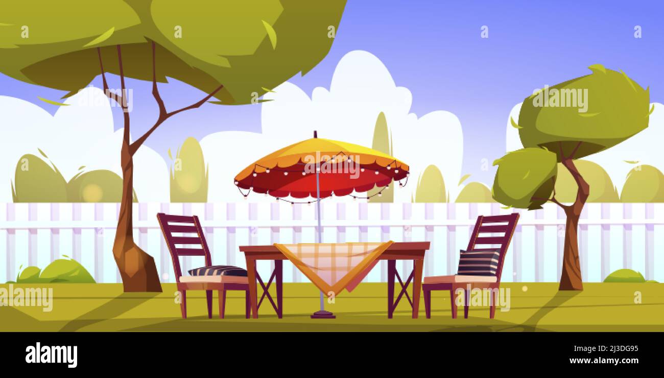 Backyard with fence, table, chairs, umbrella, green trees and grass ...