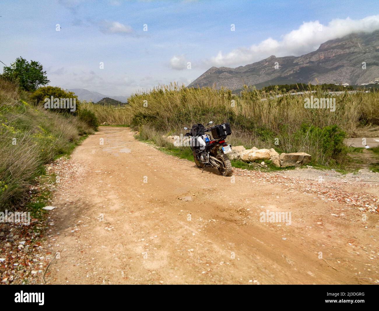 Motorbike along the Altea trail with the Algar river to the right Stock ...