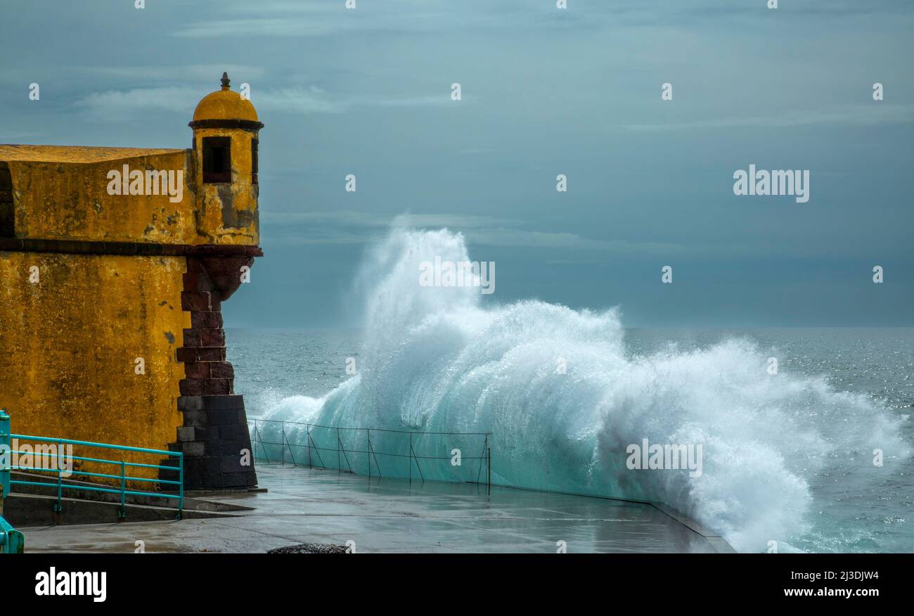 Waves breaking in front of the Fort of São Tiago located in the ...