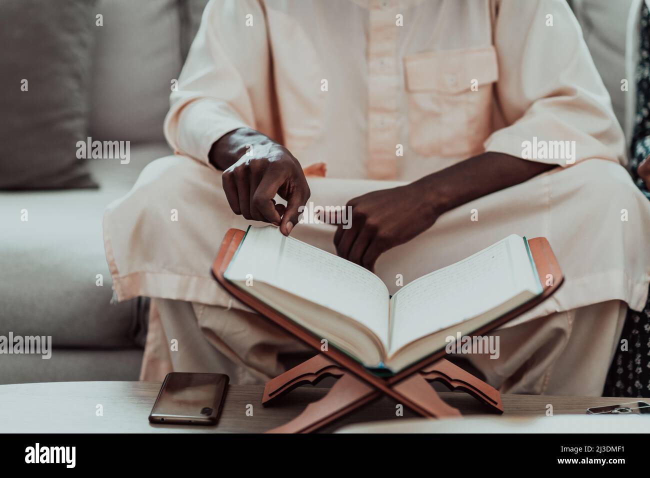 African Muslim couple at home in Ramadan reading Quran holly Islam book ...