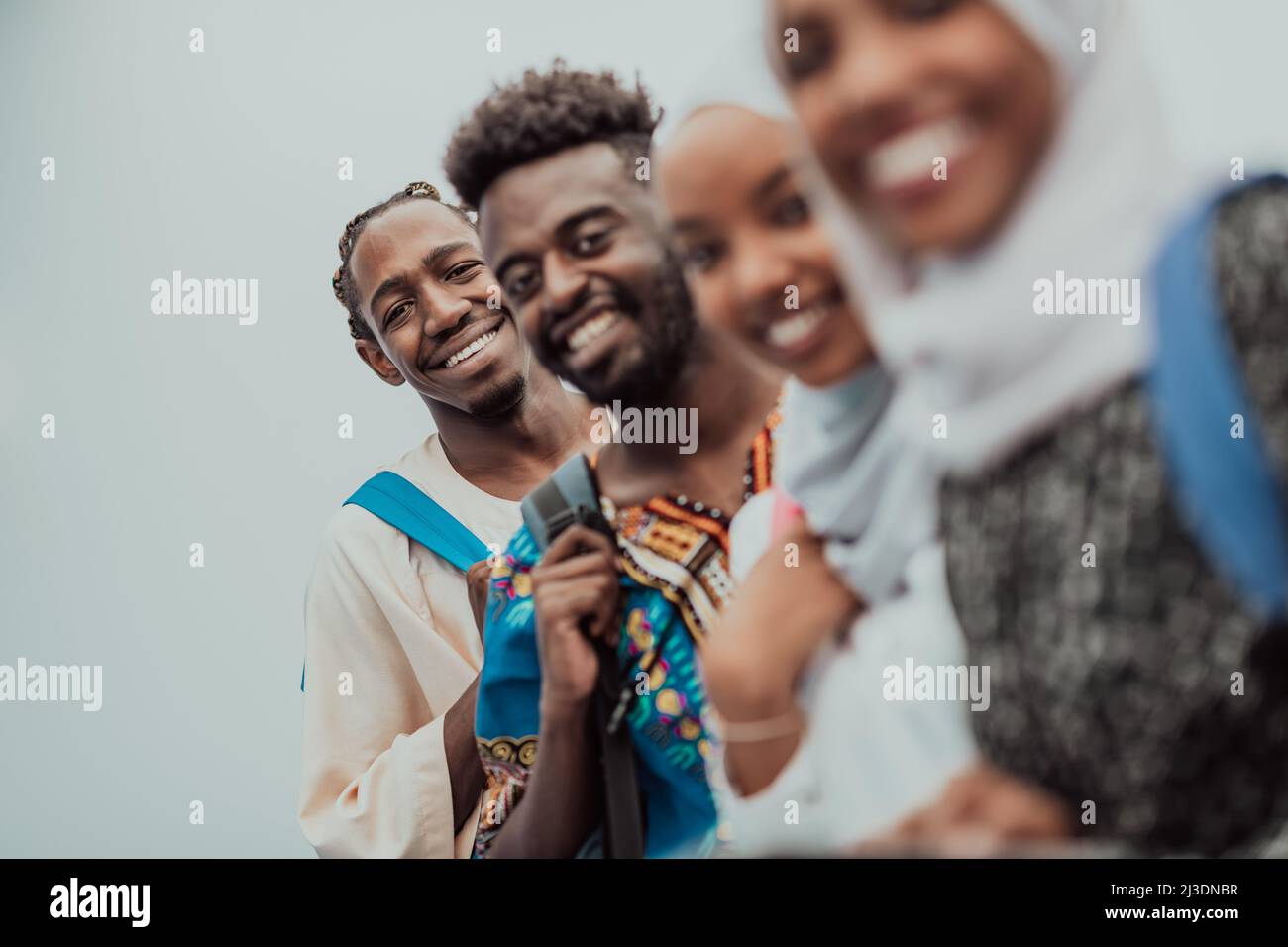 Photo of a group of happy african students talking and meeting together ...