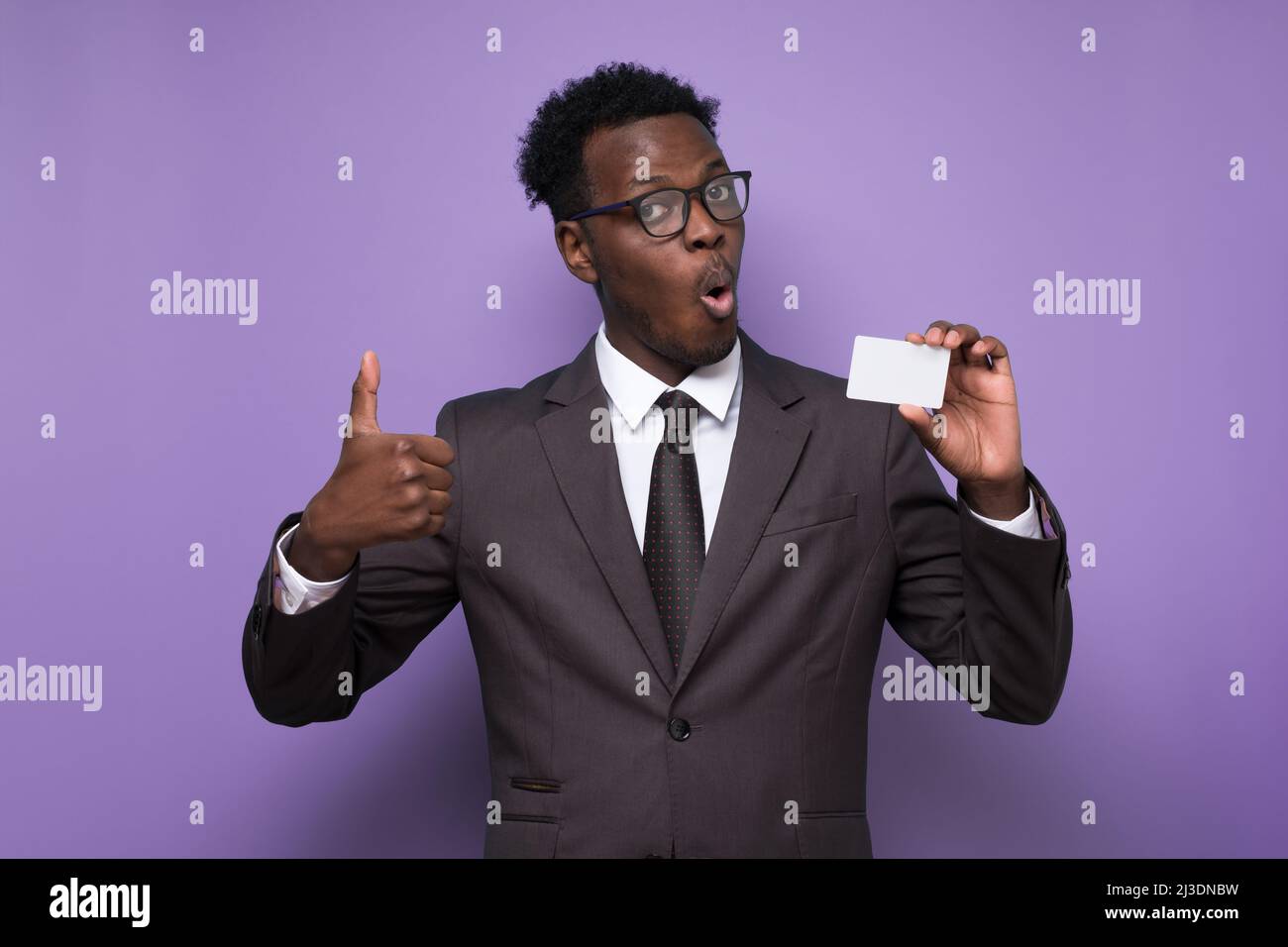 African young man bank manager showing credit card for online shopping ...