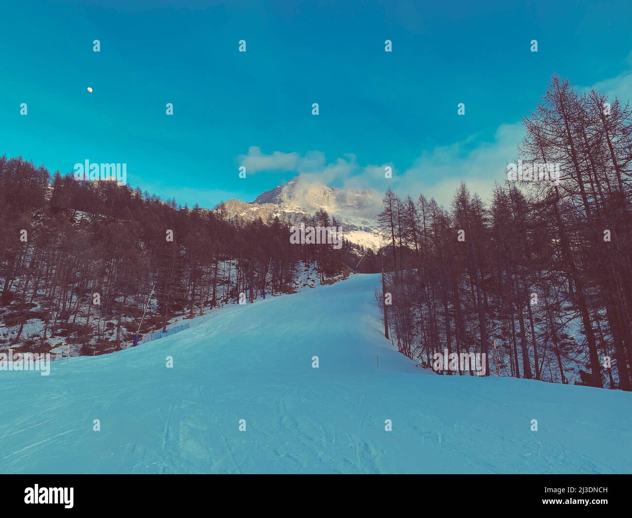 Winter landscape with mountain slopes covered with snow. Ski resort in ...