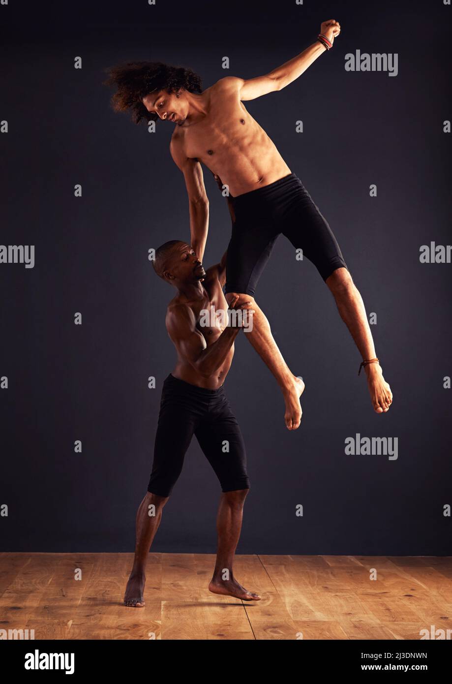 Power to help him fly. Two male contemporary dancers performing a ...