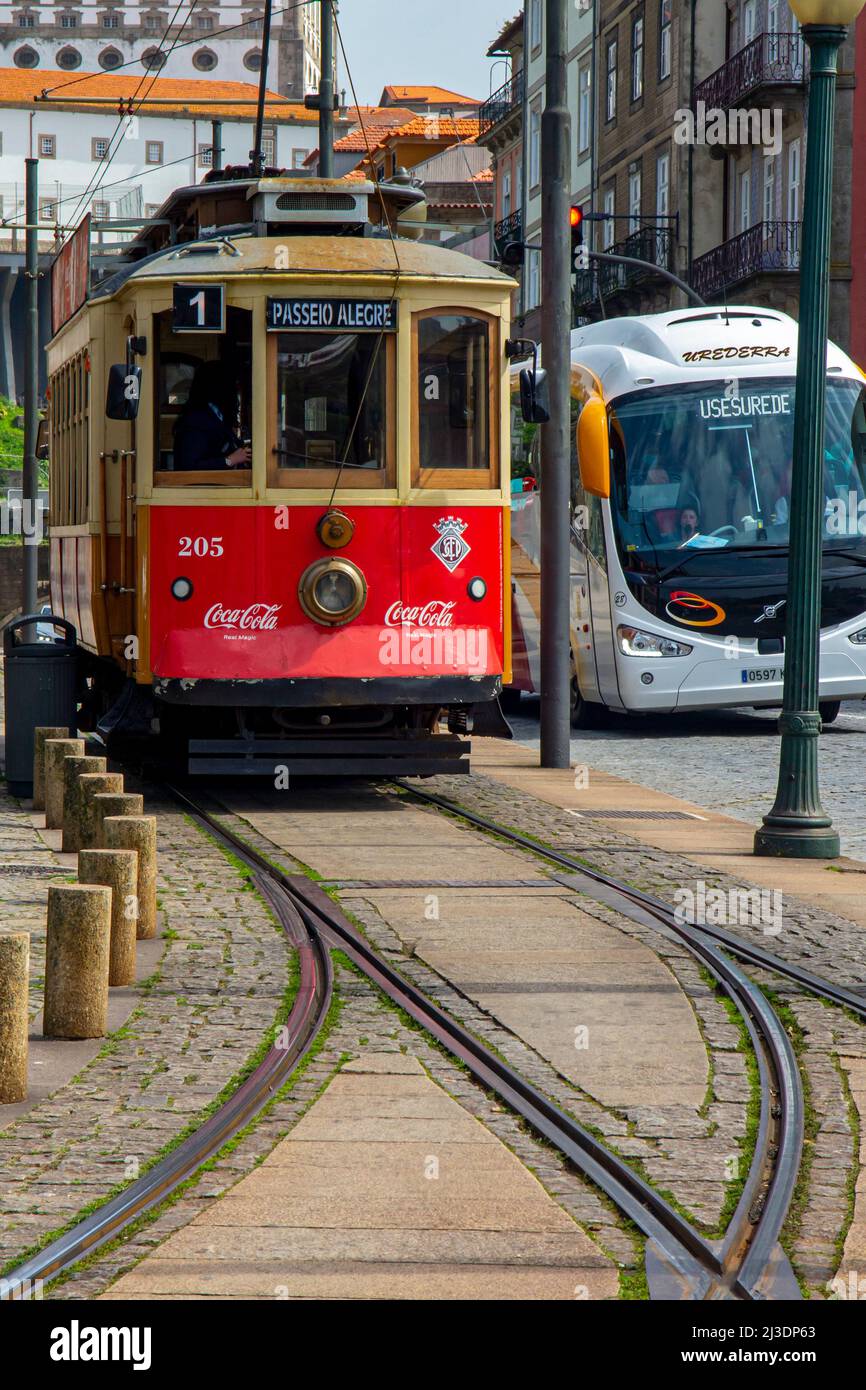 Porto tram 205 next to a bus at the Igreja de Sao Francisco stop in the ...
