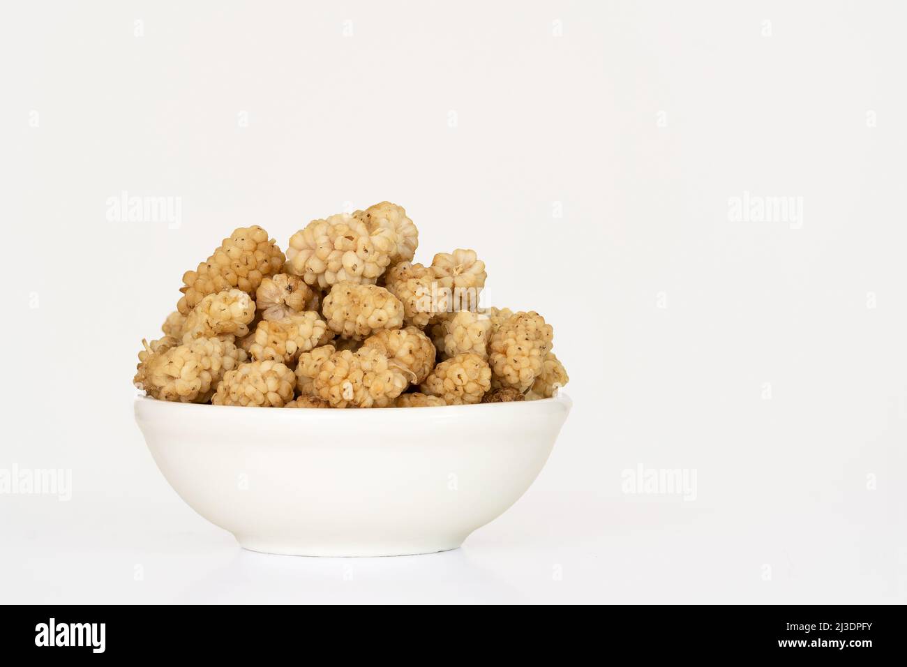 Close up photo of dried raw mulberry on isolated background Stock Photo ...