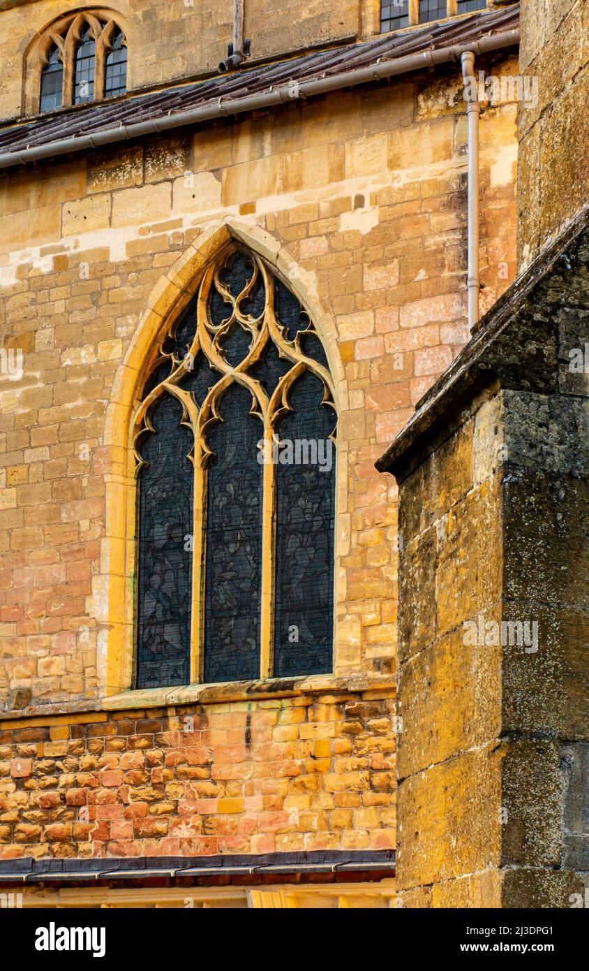 Detail of stonework and arched window at Tewkesbury Abbey in ...