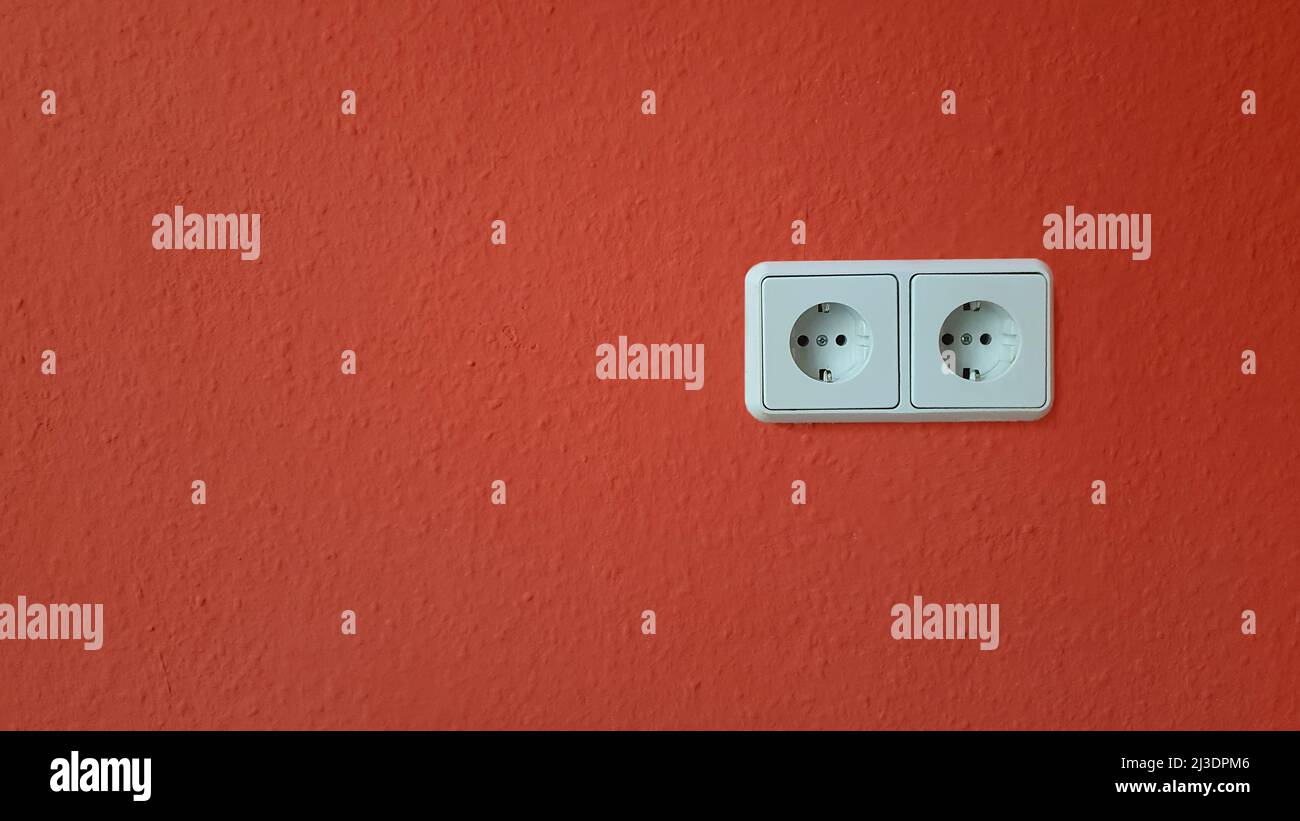 Electric outlets on painted wall Stock Photo - Alamy