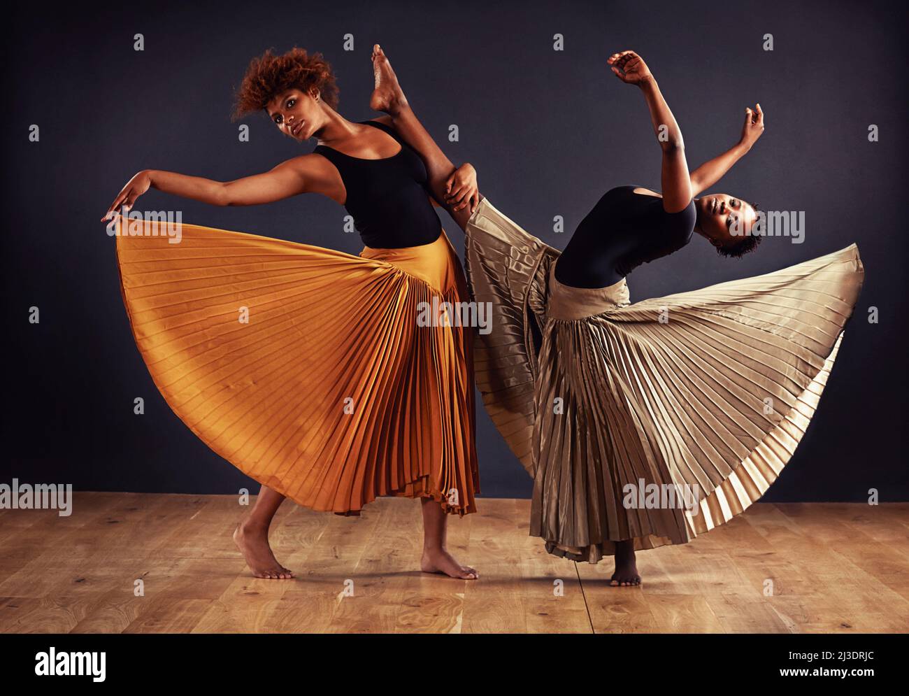 Practice and dedication make perfection. Two contemporary dancers with ...