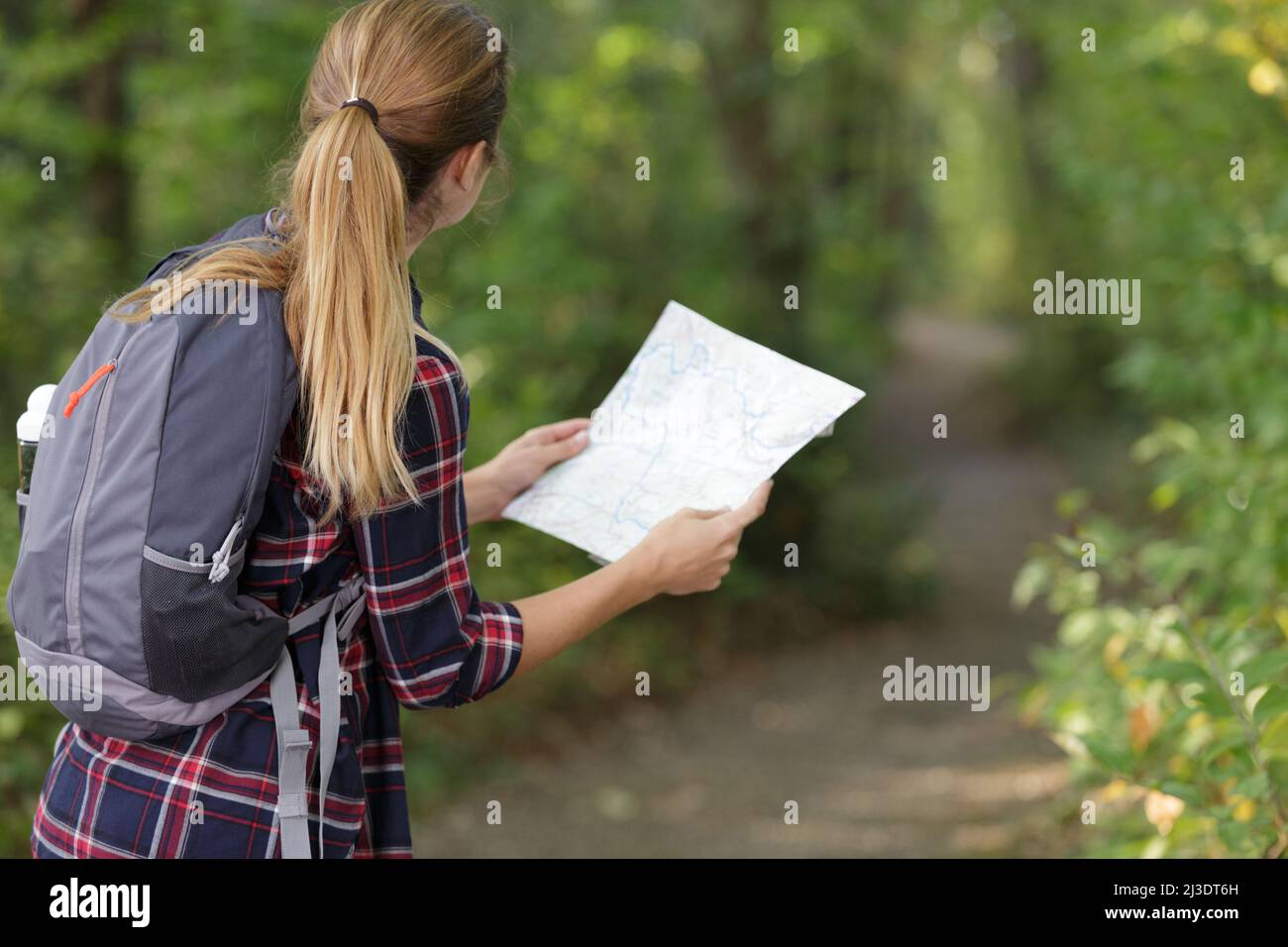 hiker with a map Stock Photo - Alamy