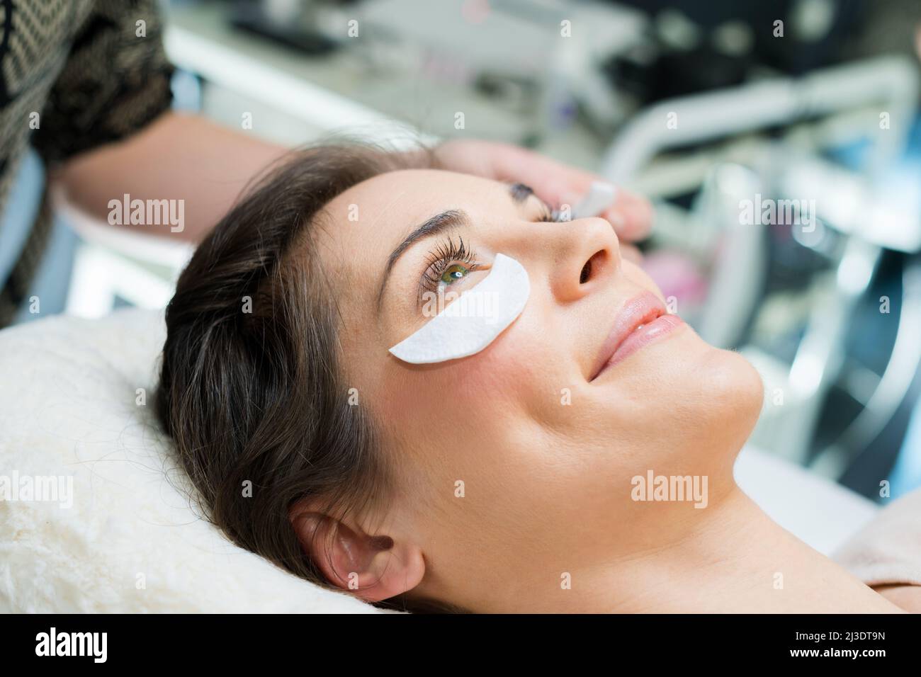 putting patch underneath the eyes Stock Photo - Alamy