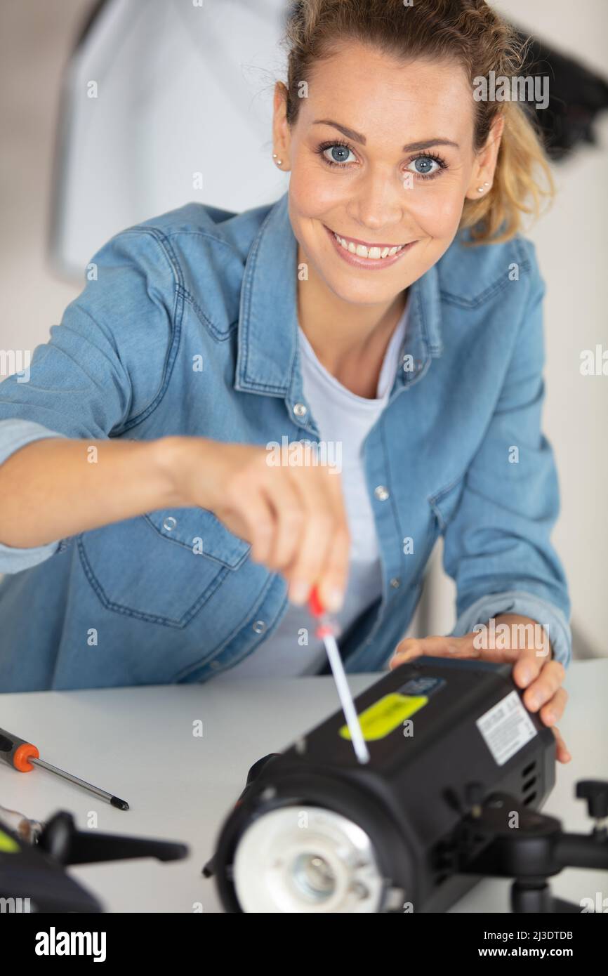 woman with a tester and a printed circuit board Stock Photo - Alamy